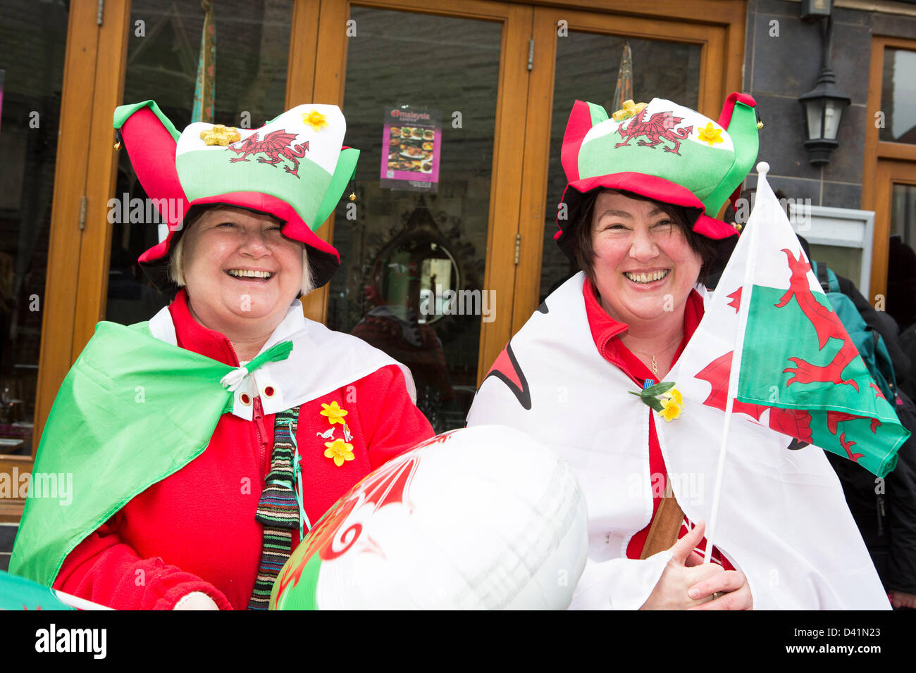 Two ladies in Welsh flags and hats celebrate St Davids Day in Cardiff ...