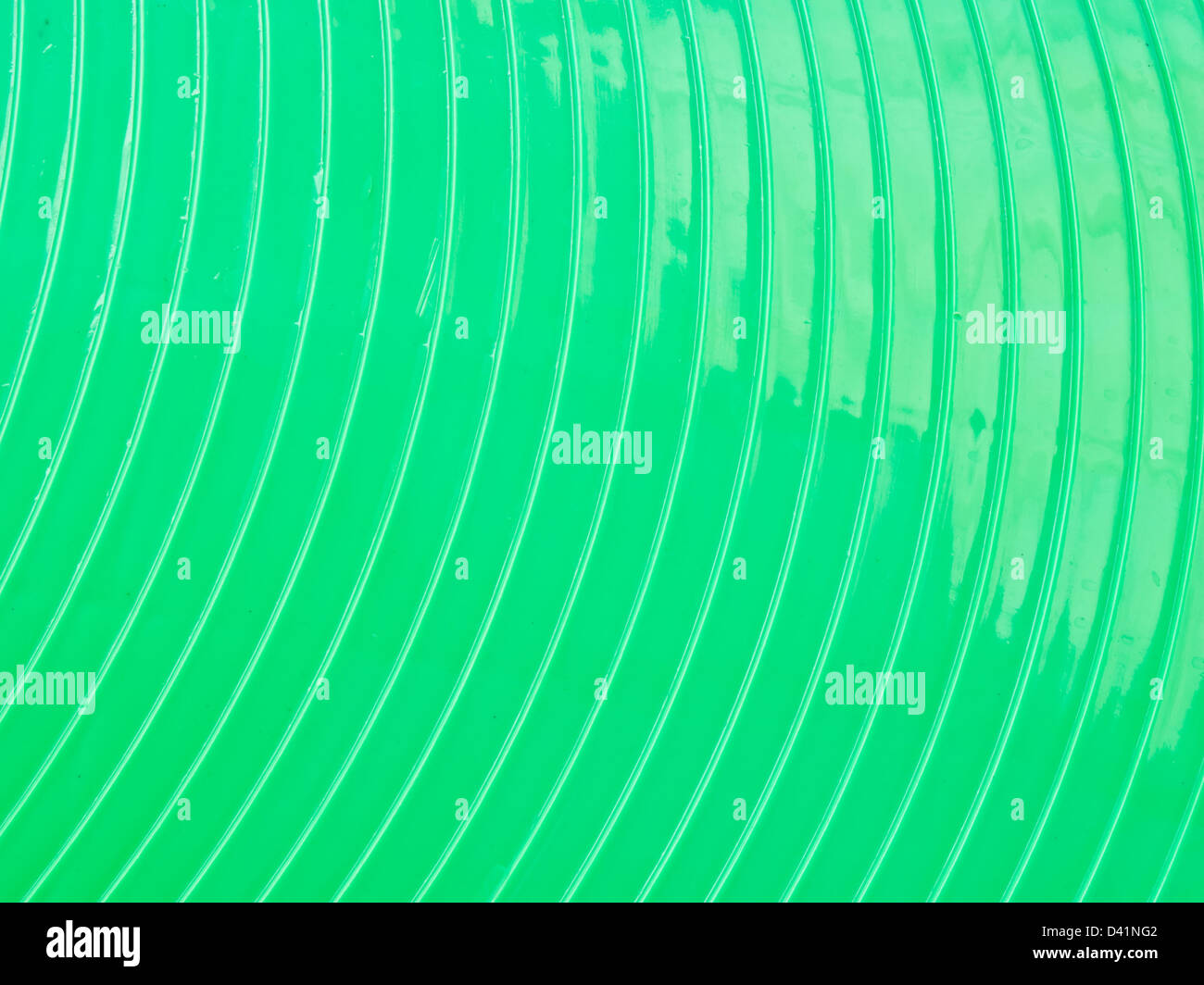 Curved green plastic as background Stock Photo - Alamy