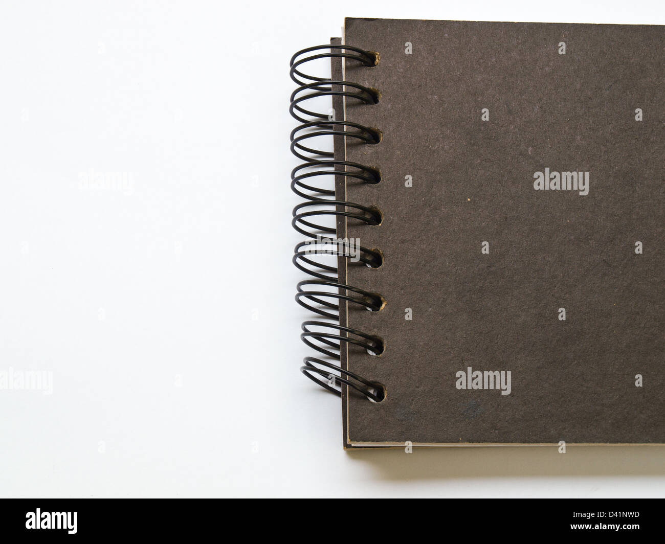 A black spiral binding notebook on white Stock Photo - Alamy