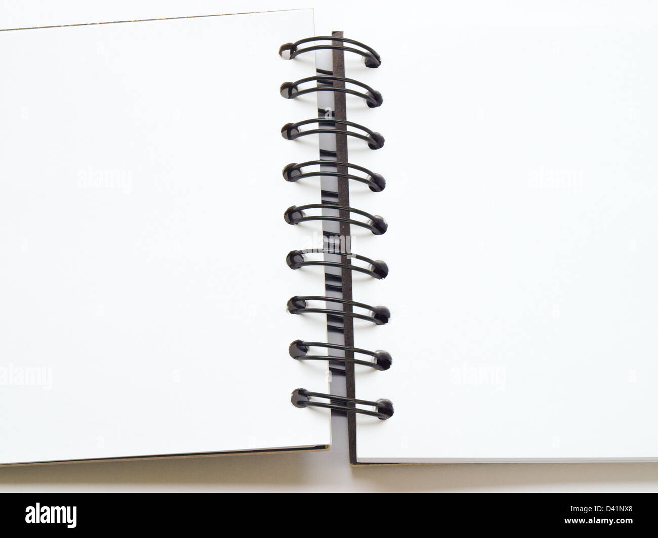 An open spiral binding notebook Stock Photo - Alamy