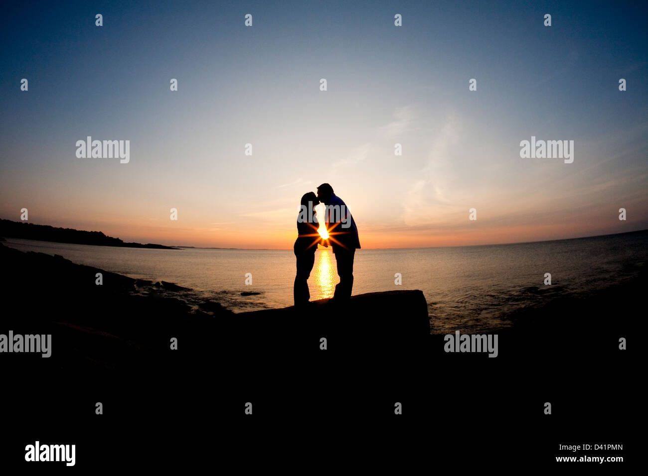couple, kiss, sunset, ocean Stock Photo - Alamy