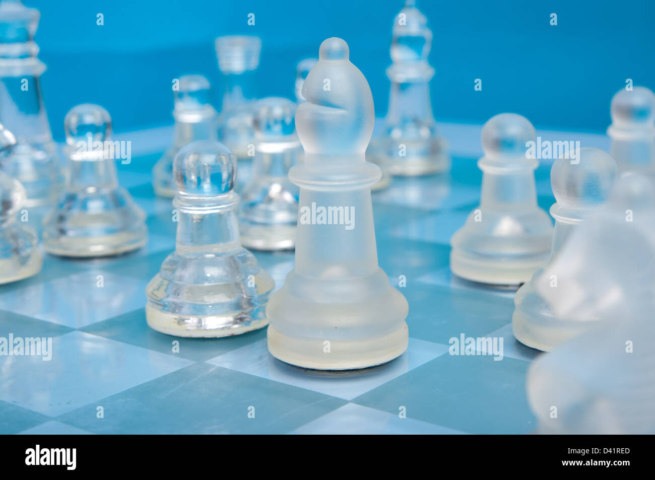 glass chess on the blue background Stock Photo - Alamy