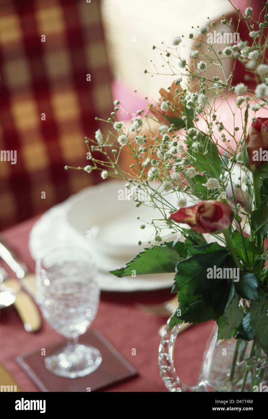 Still-Life of vase of flowers on soft focus table Stock Photo - Alamy