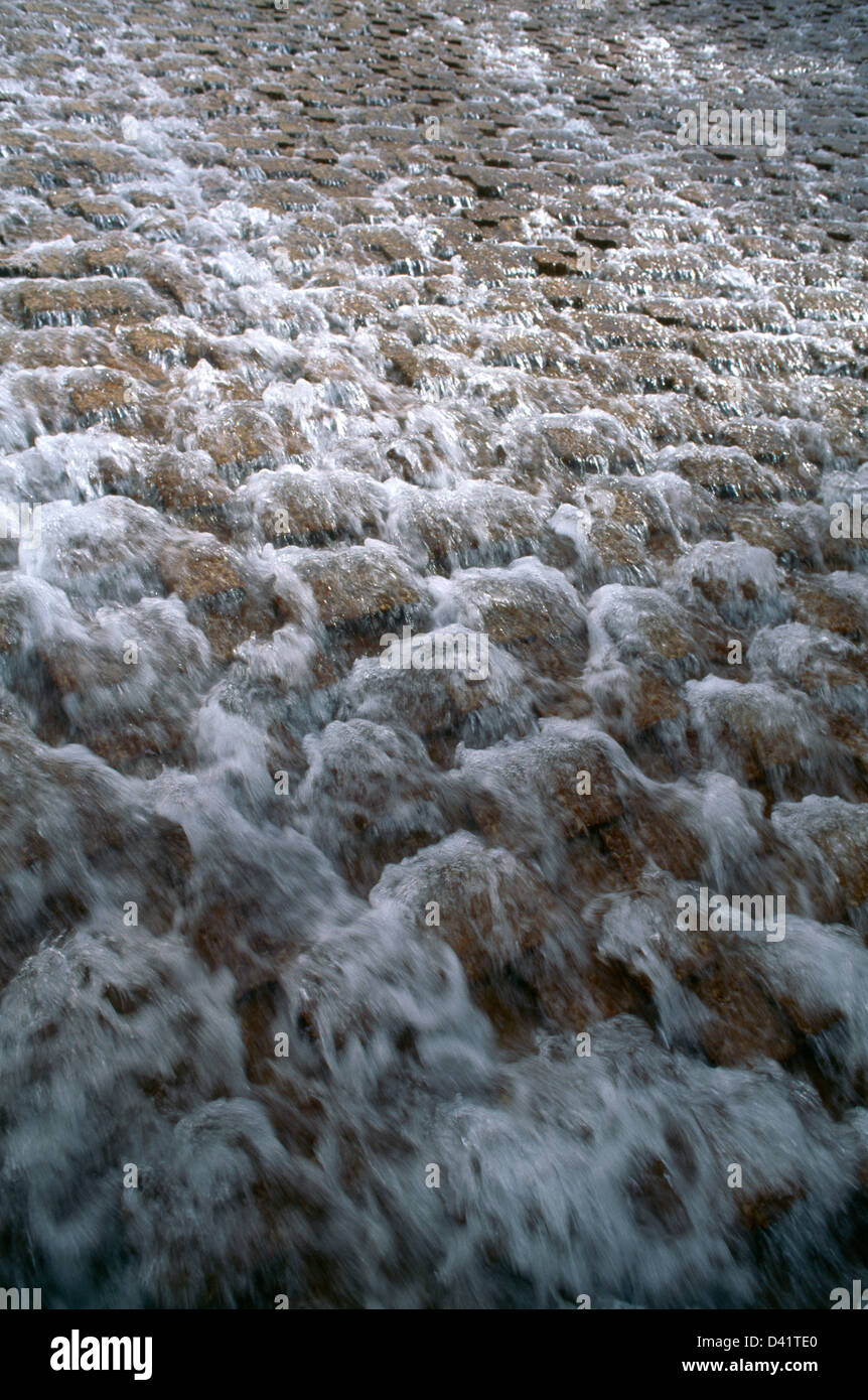 Fountain Water Running Over Stones Stock Photo - Alamy