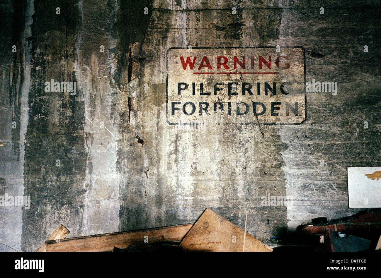 Old sign in abandoned warehouse Stock Photo - Alamy