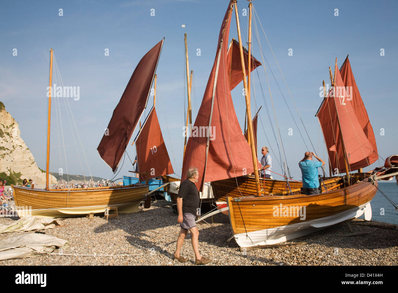 Beer Luggers on Beer beach making ready for sail, Devon, England Stock ...