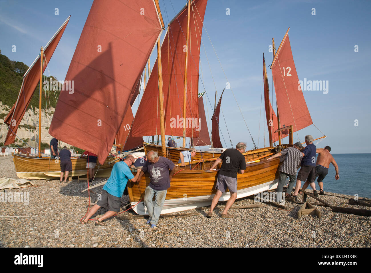 Beer Luggers on Beer beach making ready for sail, Devon, England Stock ...
