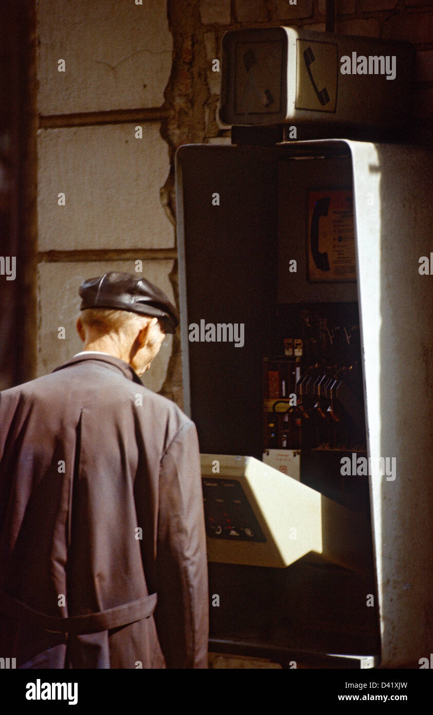Berlin, GDR, man considered a broken phone booth Stock Photo - Alamy