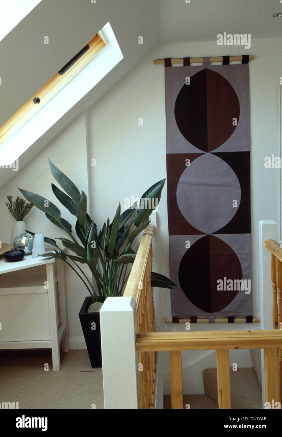 Black+gray cotton wall-hanging on modern loft landing with large green ...