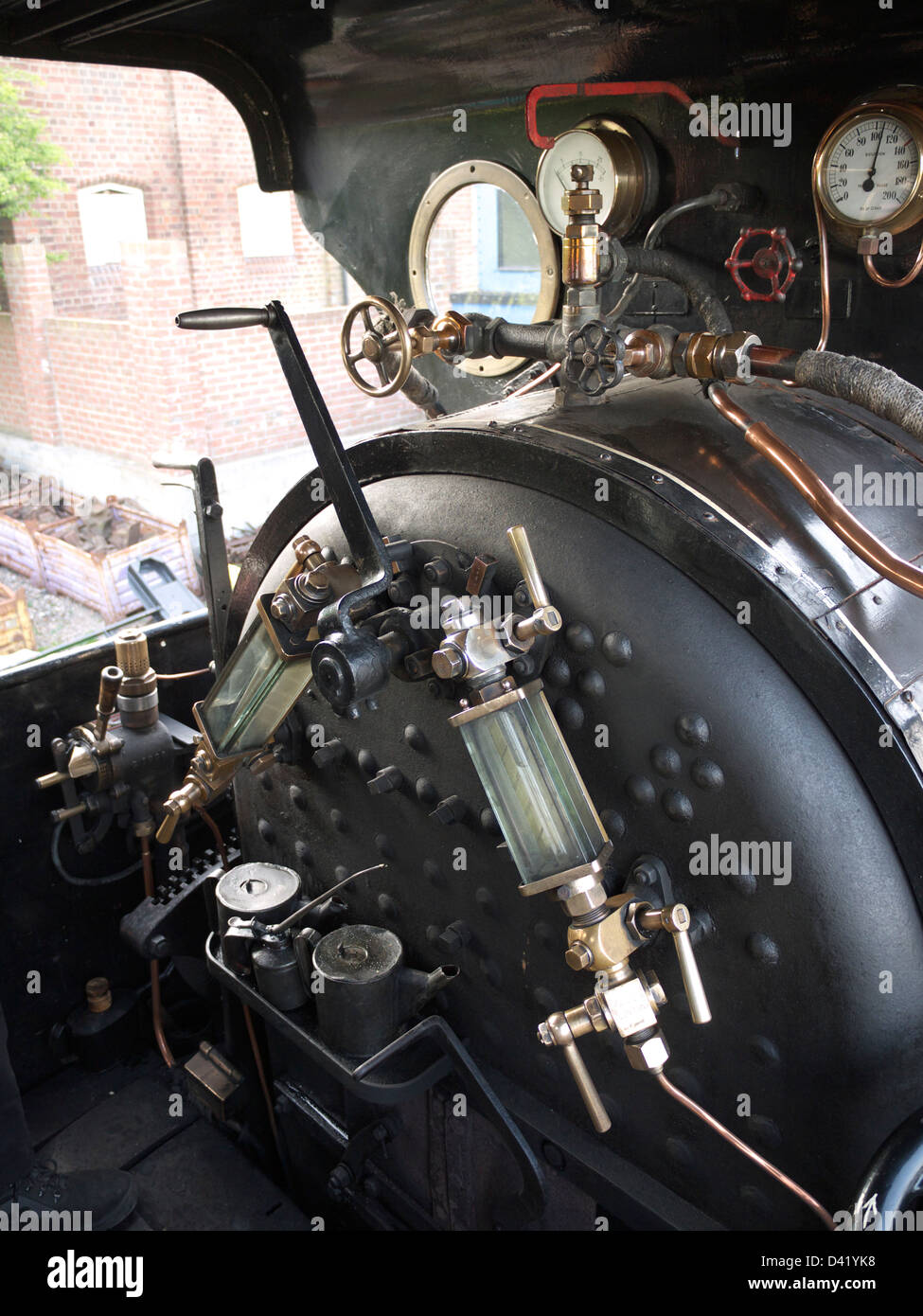 Inside the cab of a steam locomotive, seen at the Lincs Wolds railway ...