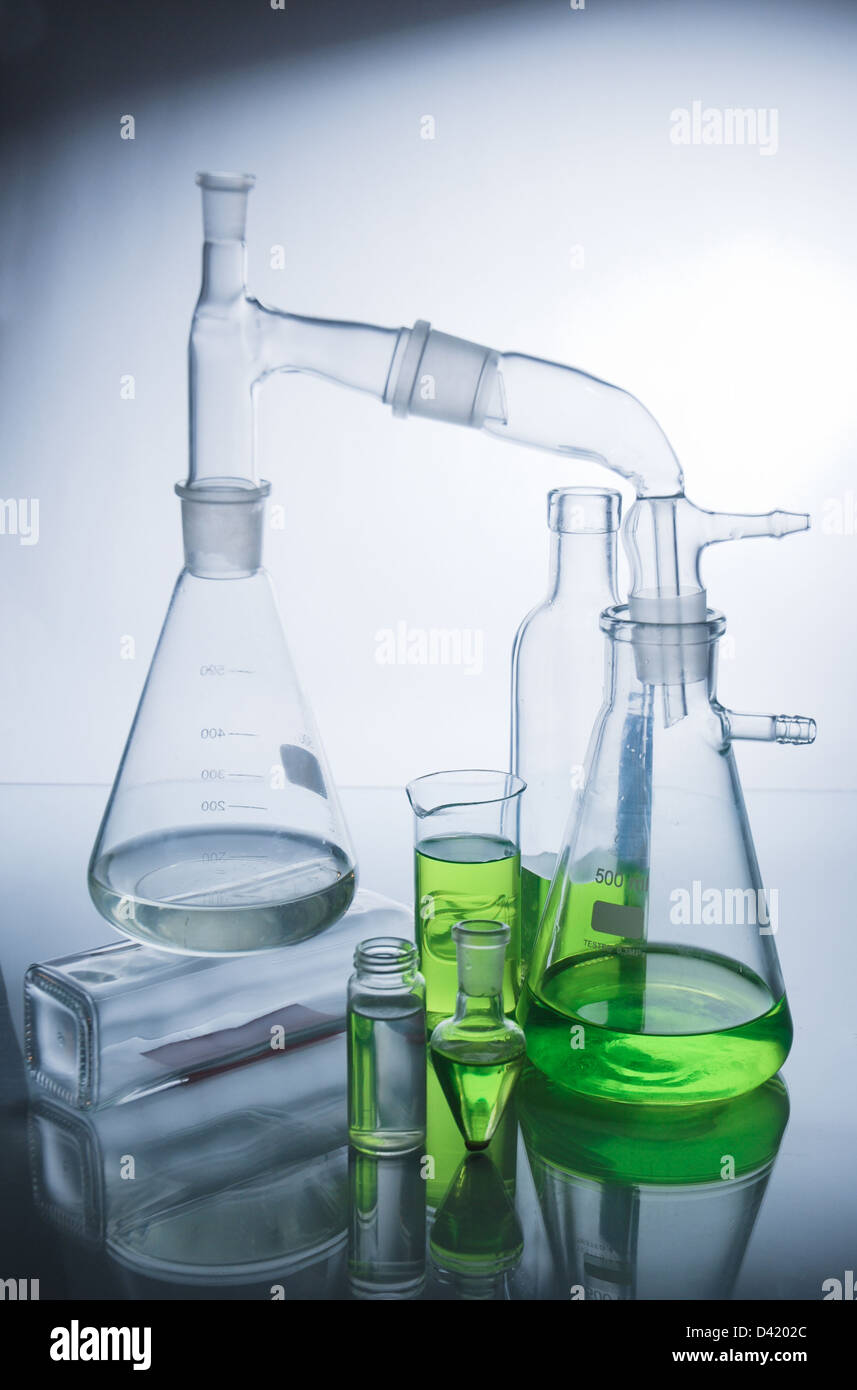 Laboratory glassware over white background Stock Photo - Alamy