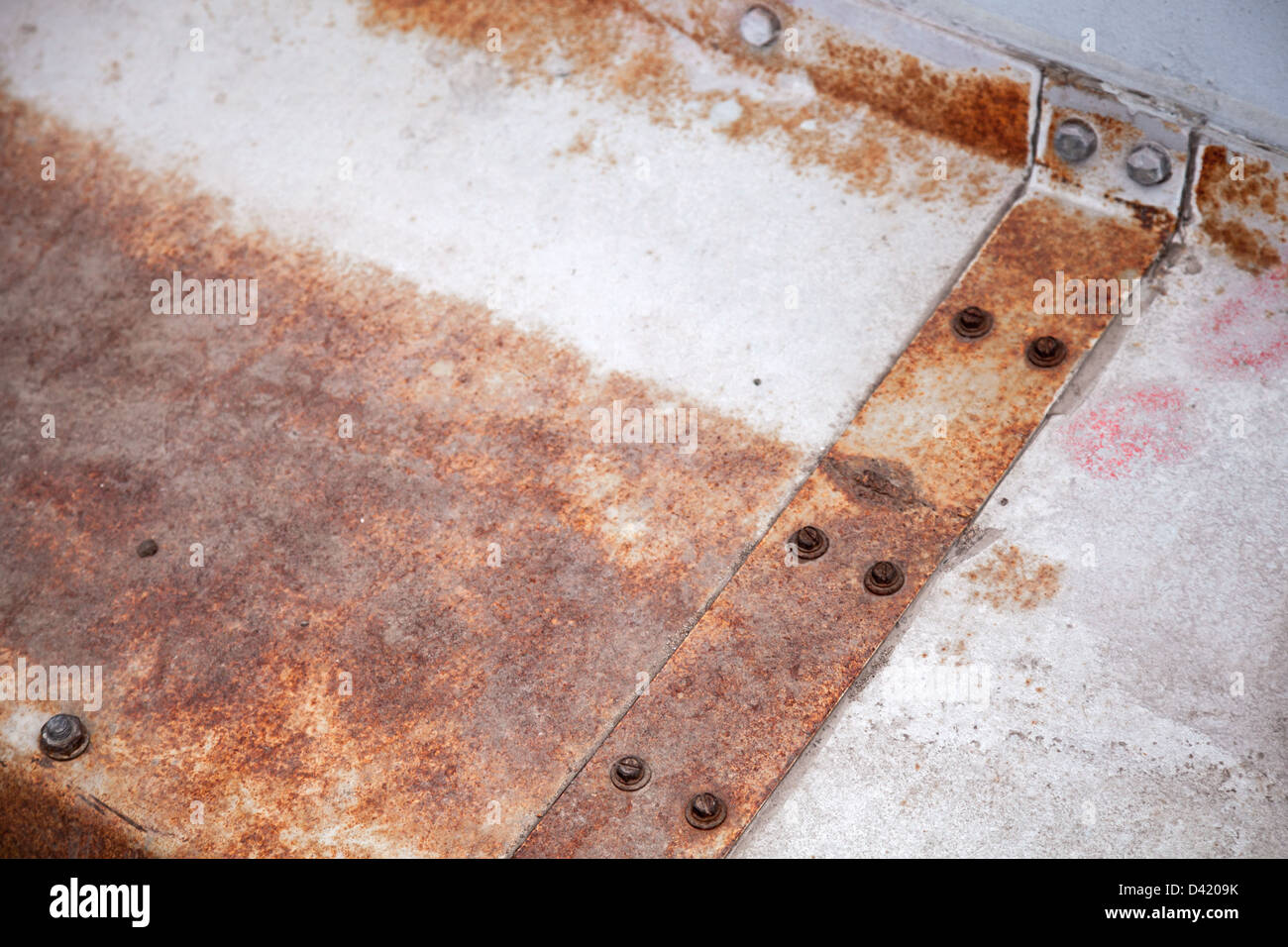 Industrial abstract rusted element with bolts Stock Photo - Alamy