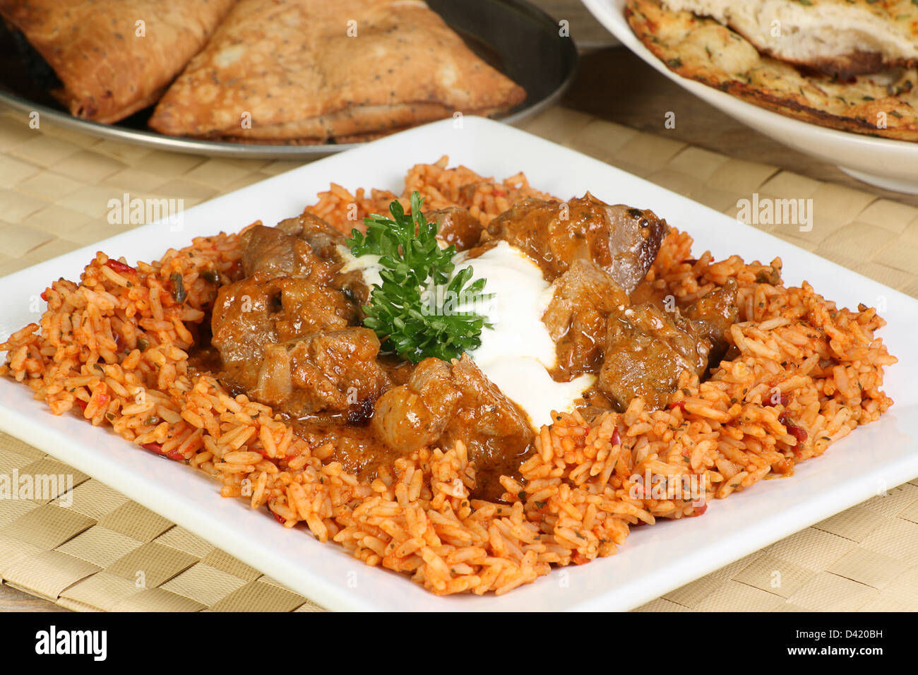 Lamb Curry with rice and sour cream Stock Photo - Alamy