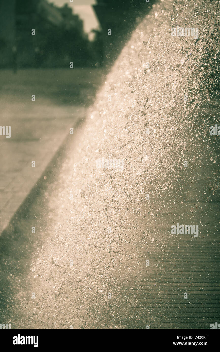 Fountain Falling Stream. Toned image Stock Photo - Alamy