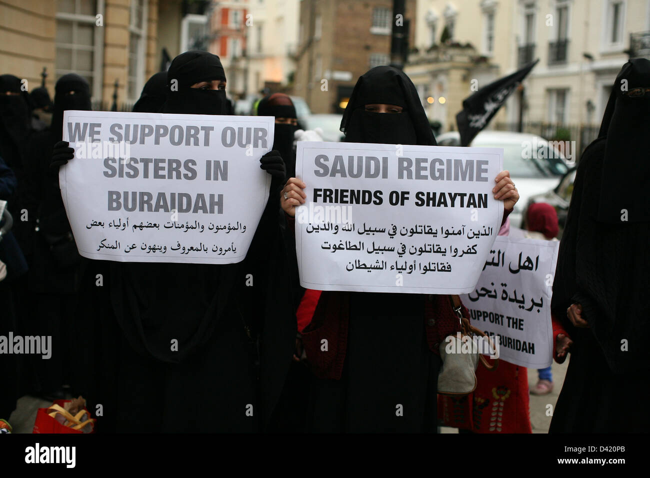Veiled women from an Islamic protest group led by cleric Anjem Choudry ...