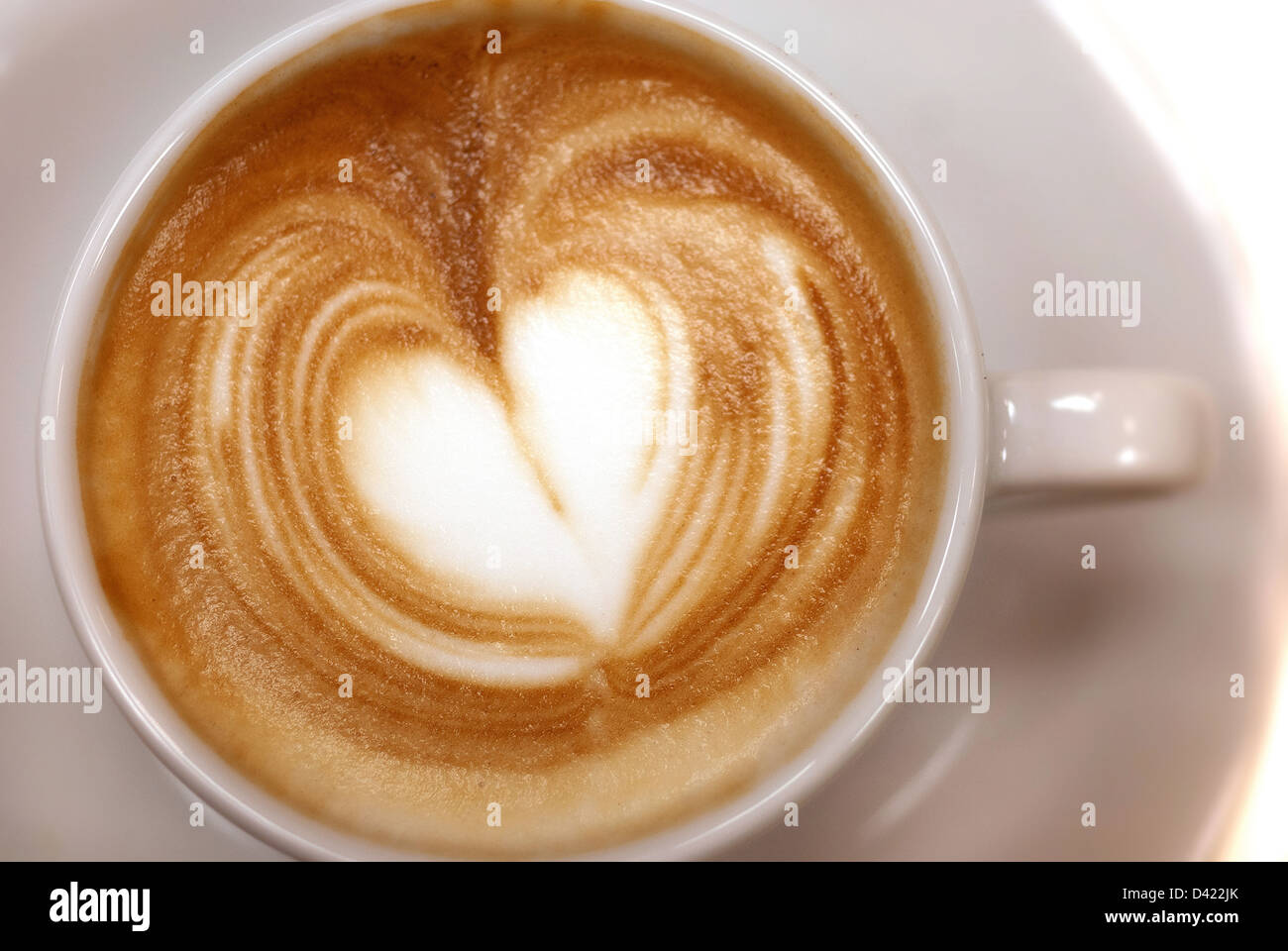 Heart formed in a cup of coffee Stock Photo - Alamy