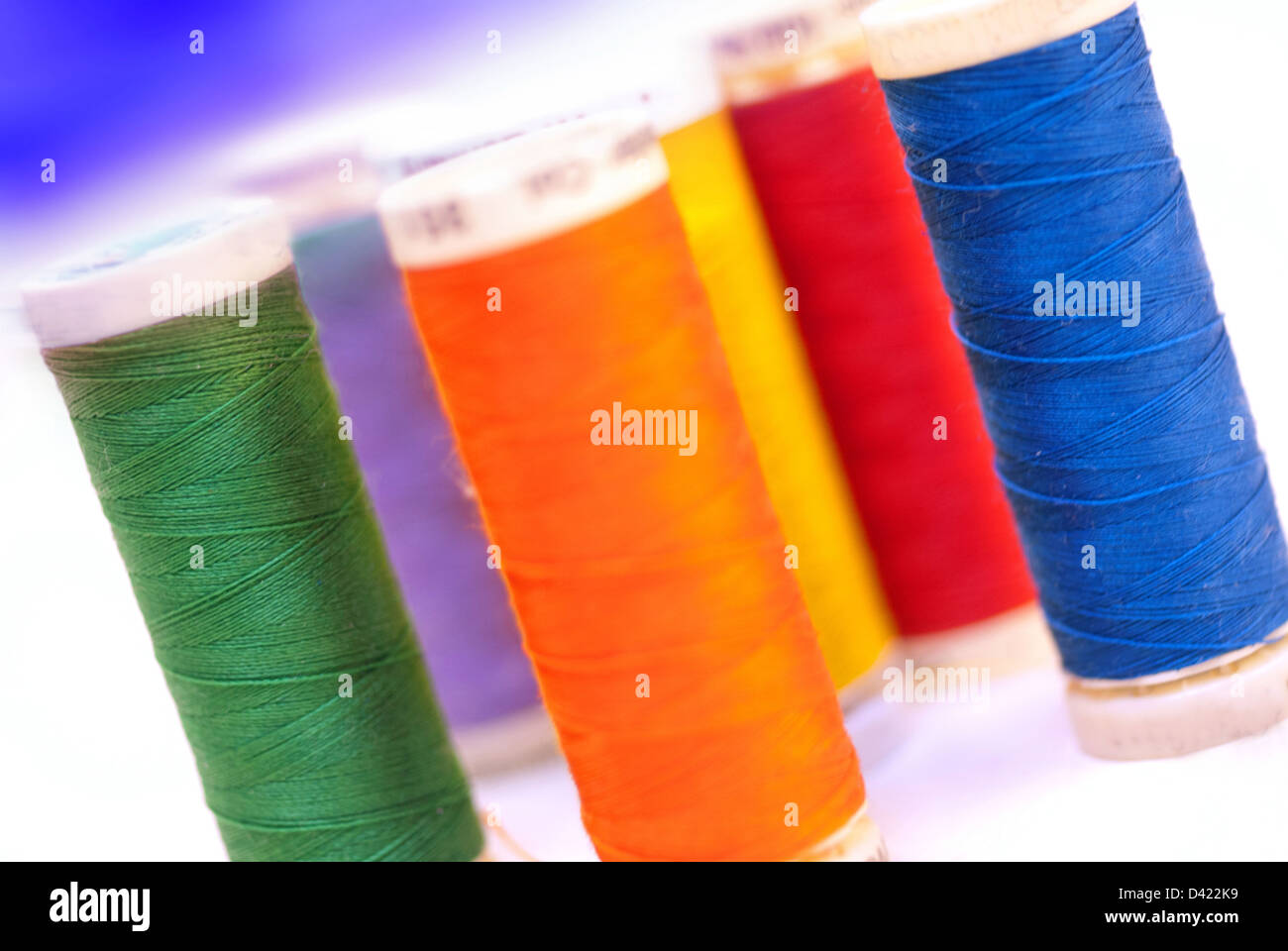 Colourful bobbins of thread Stock Photo - Alamy