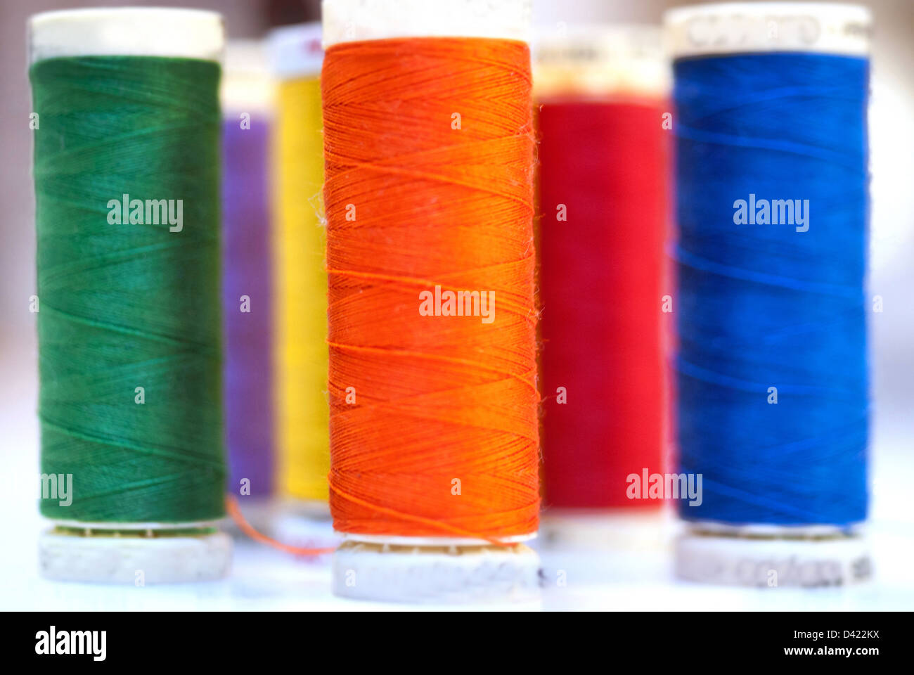 Colourful bobbins of thread Stock Photo - Alamy