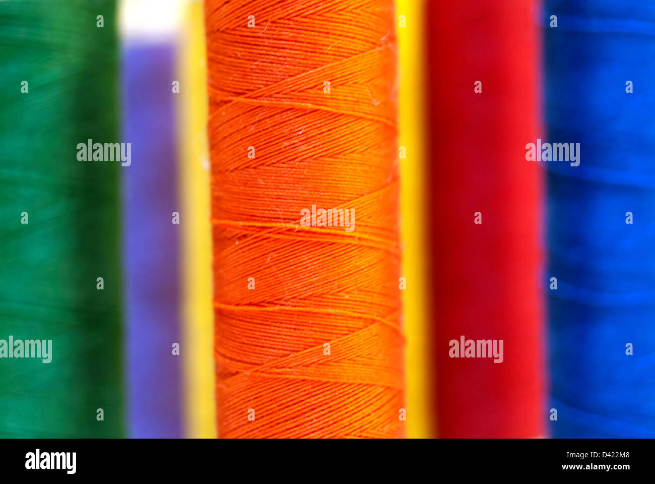 Colourful bobbins of thread Stock Photo - Alamy