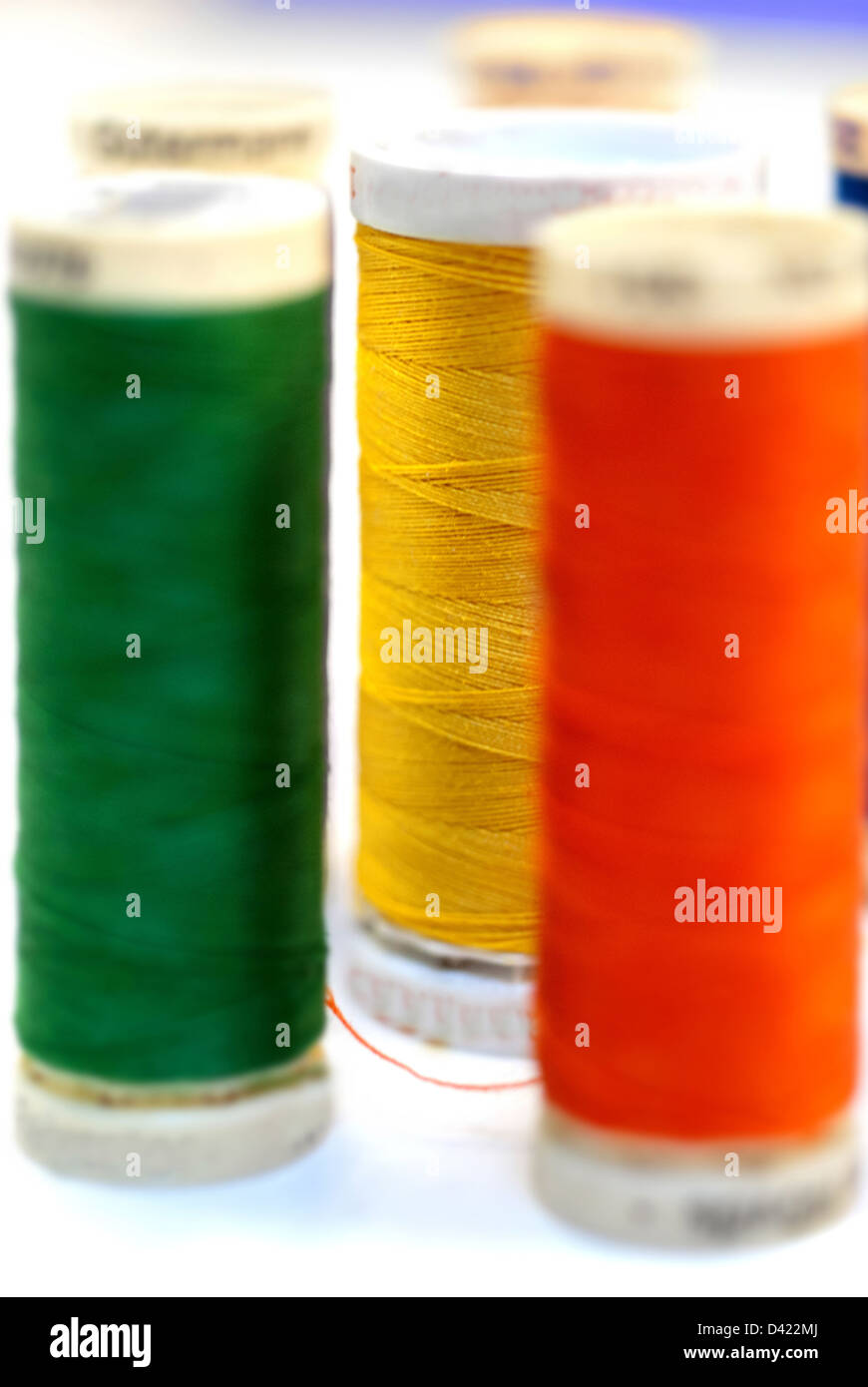 Colourful bobbins of thread Stock Photo - Alamy