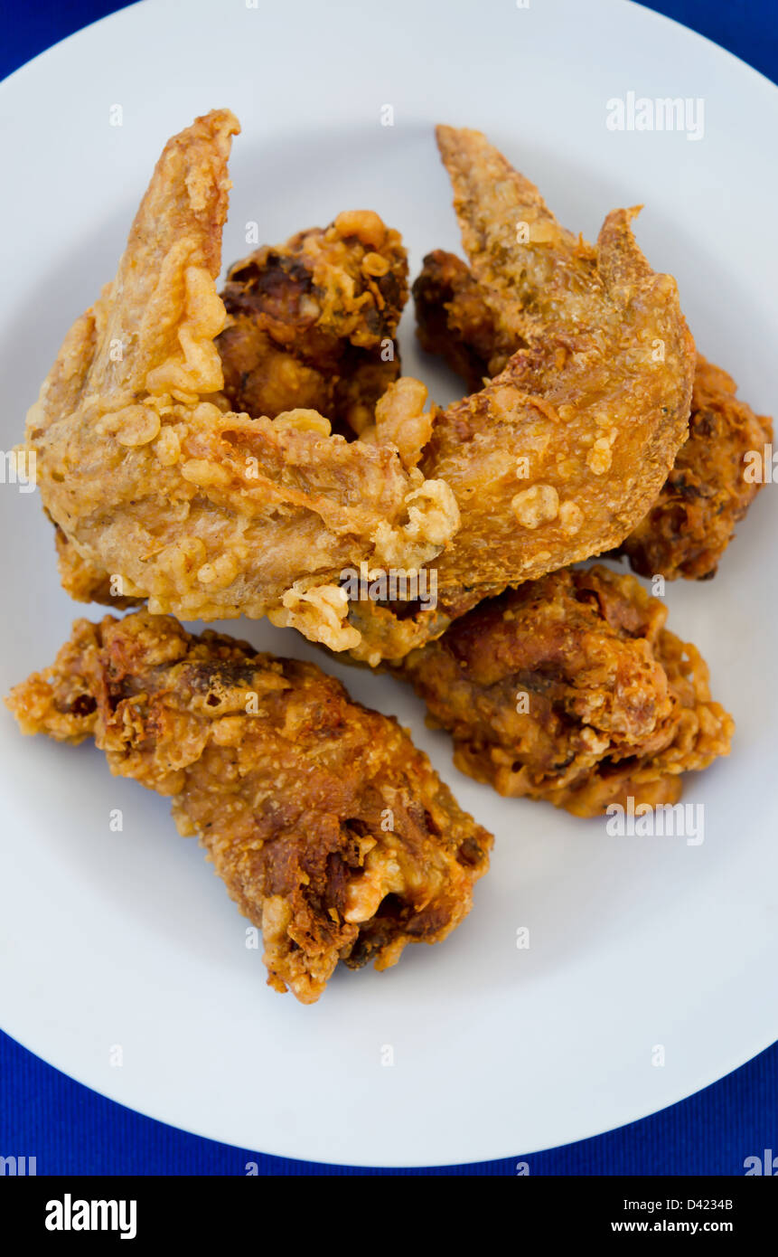 fried chicken on dish , blue background , fast food Stock Photo - Alamy