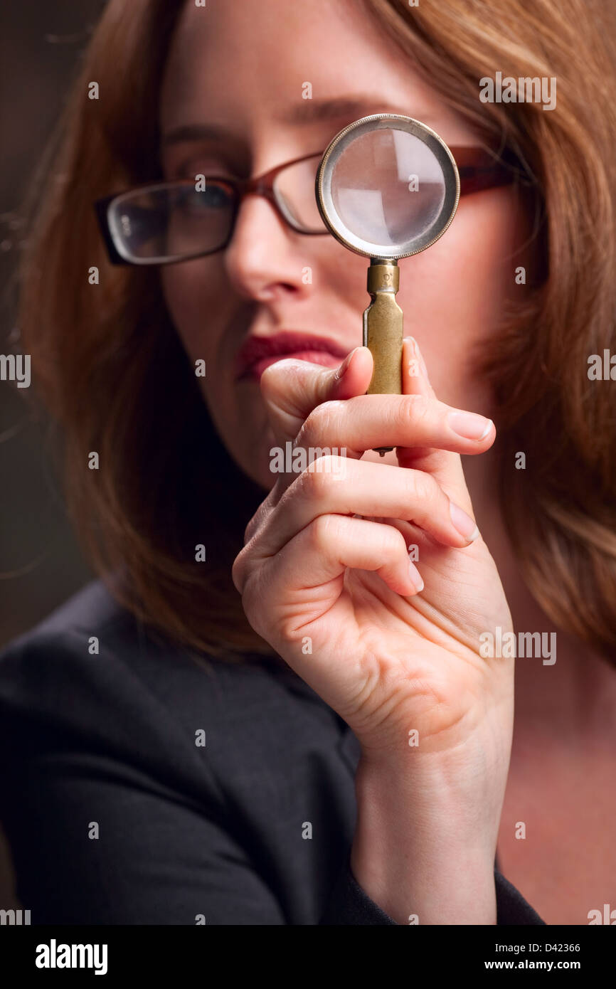 Looking with magnifying glass hi-res stock photography and images - Alamy