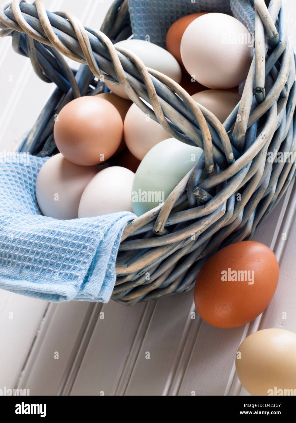 Fresh multi-color farm eggs on the table Stock Photo - Alamy