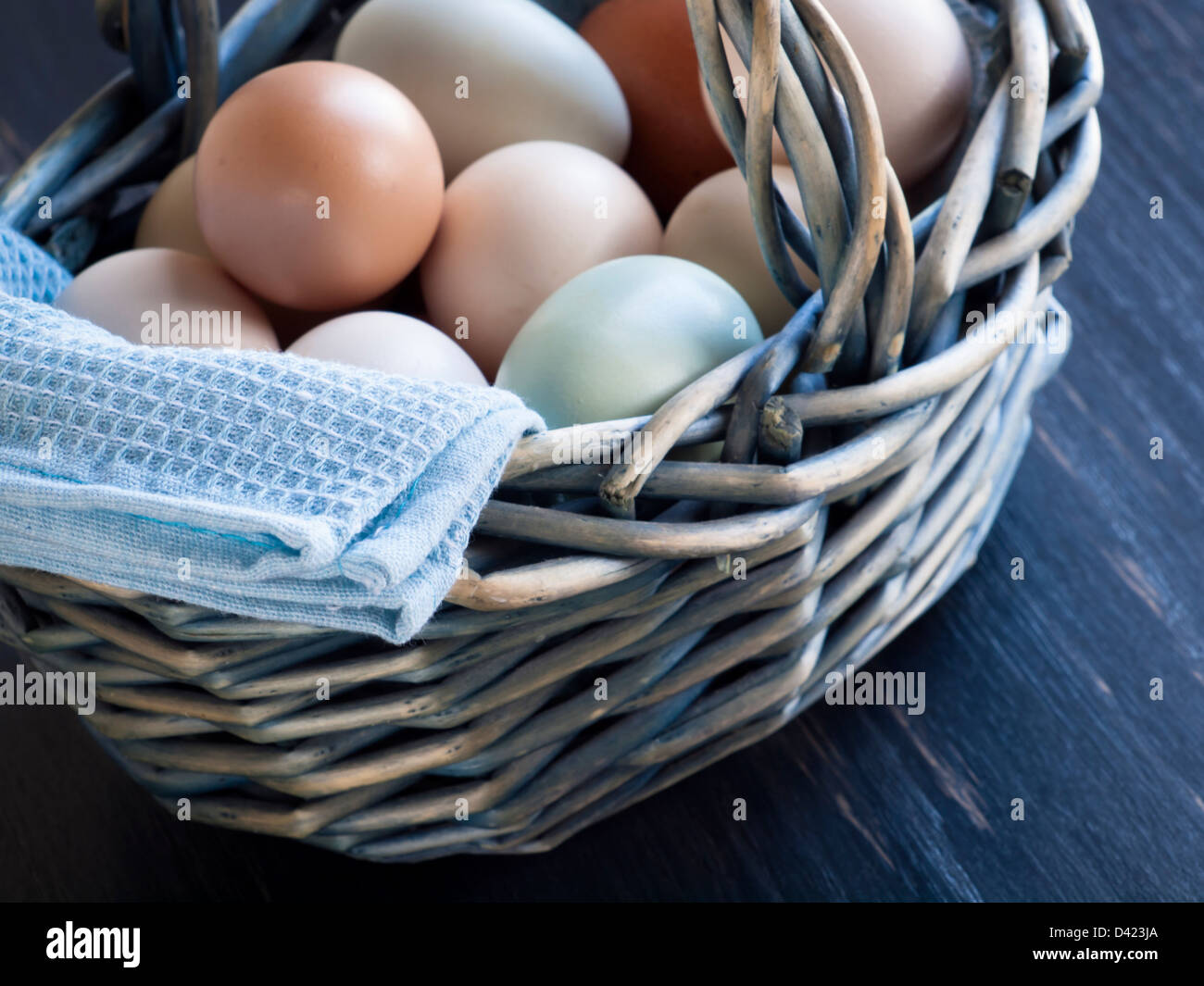 Fresh multi-color farm eggs on the table Stock Photo - Alamy