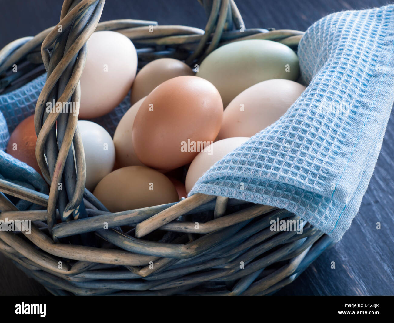 Fresh multi-color farm eggs on the table Stock Photo - Alamy