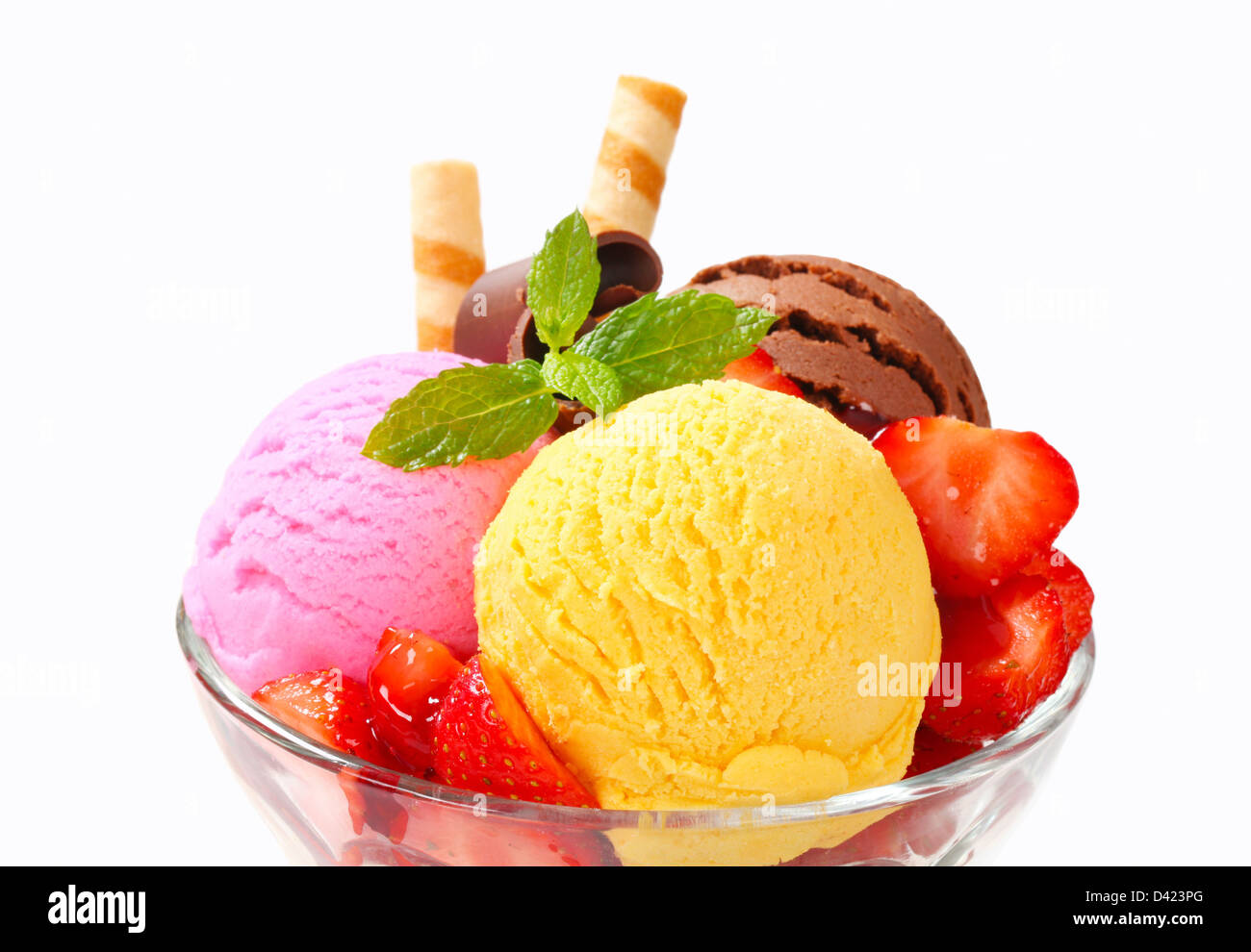 Ice cream sundae with strawberries and wafer rolls Stock Photo - Alamy