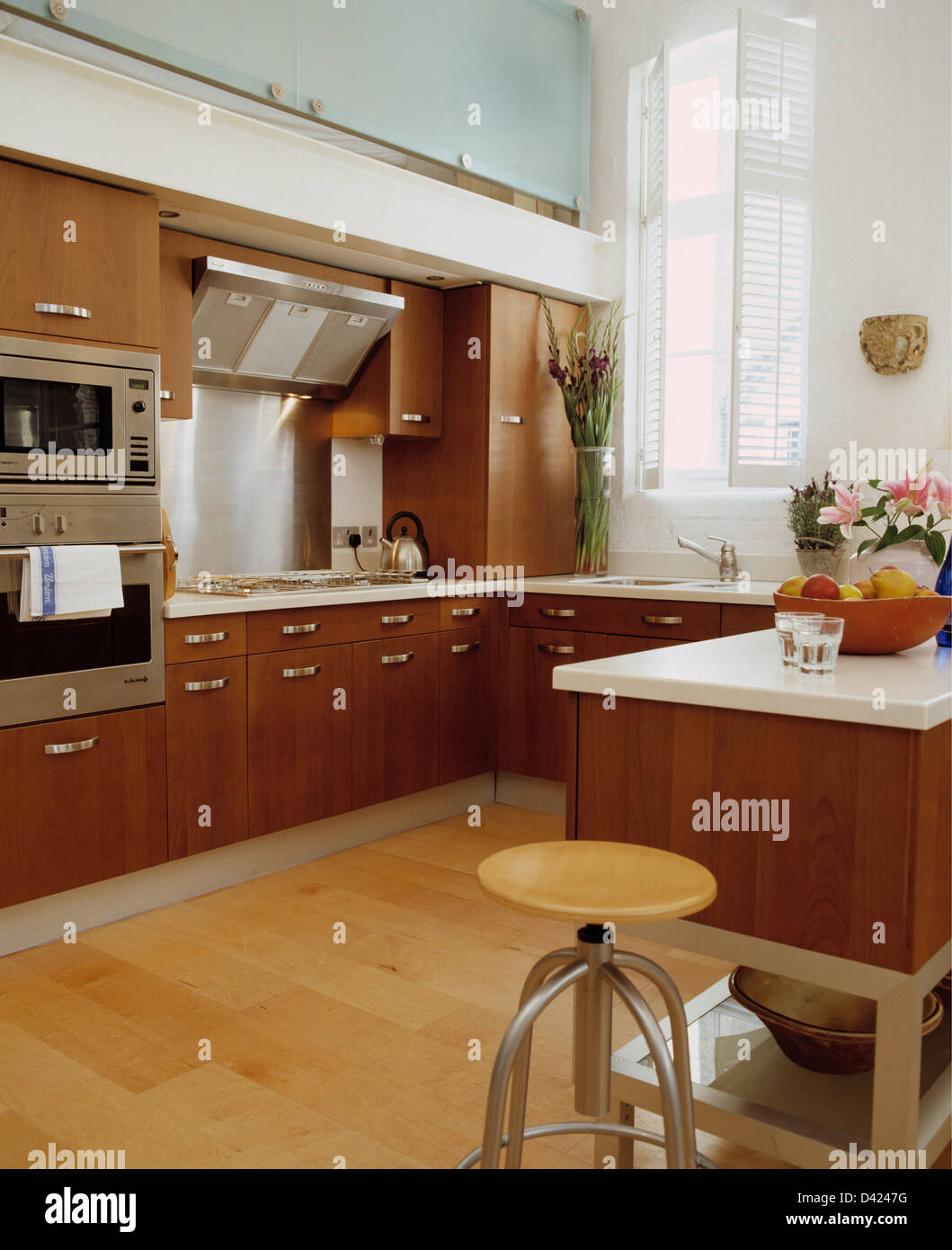 Beech+chrome stool in modern city kitchen with dark wood fitted units ...