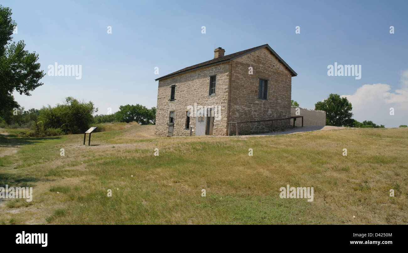 Blue sky view 1866 stone guardhouse building on green grass slope ...