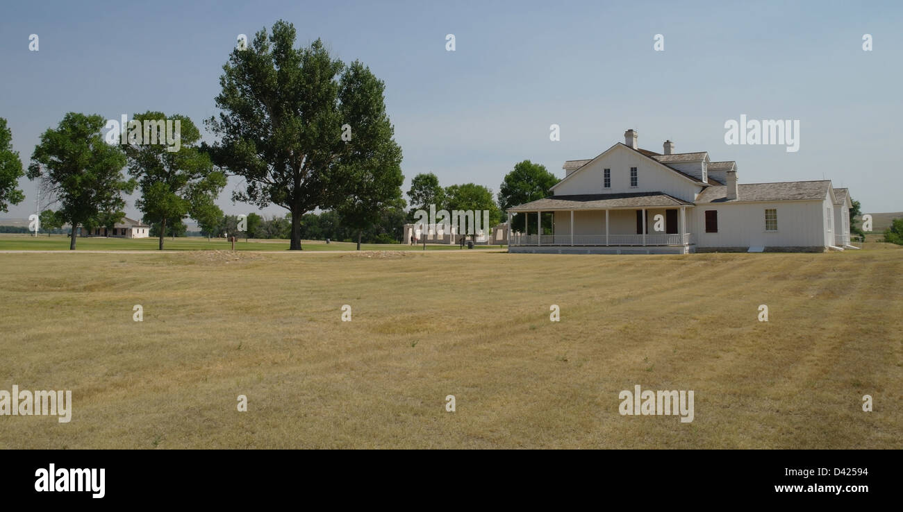 Blue sky green grass view white painted Commanding Officer's House ...
