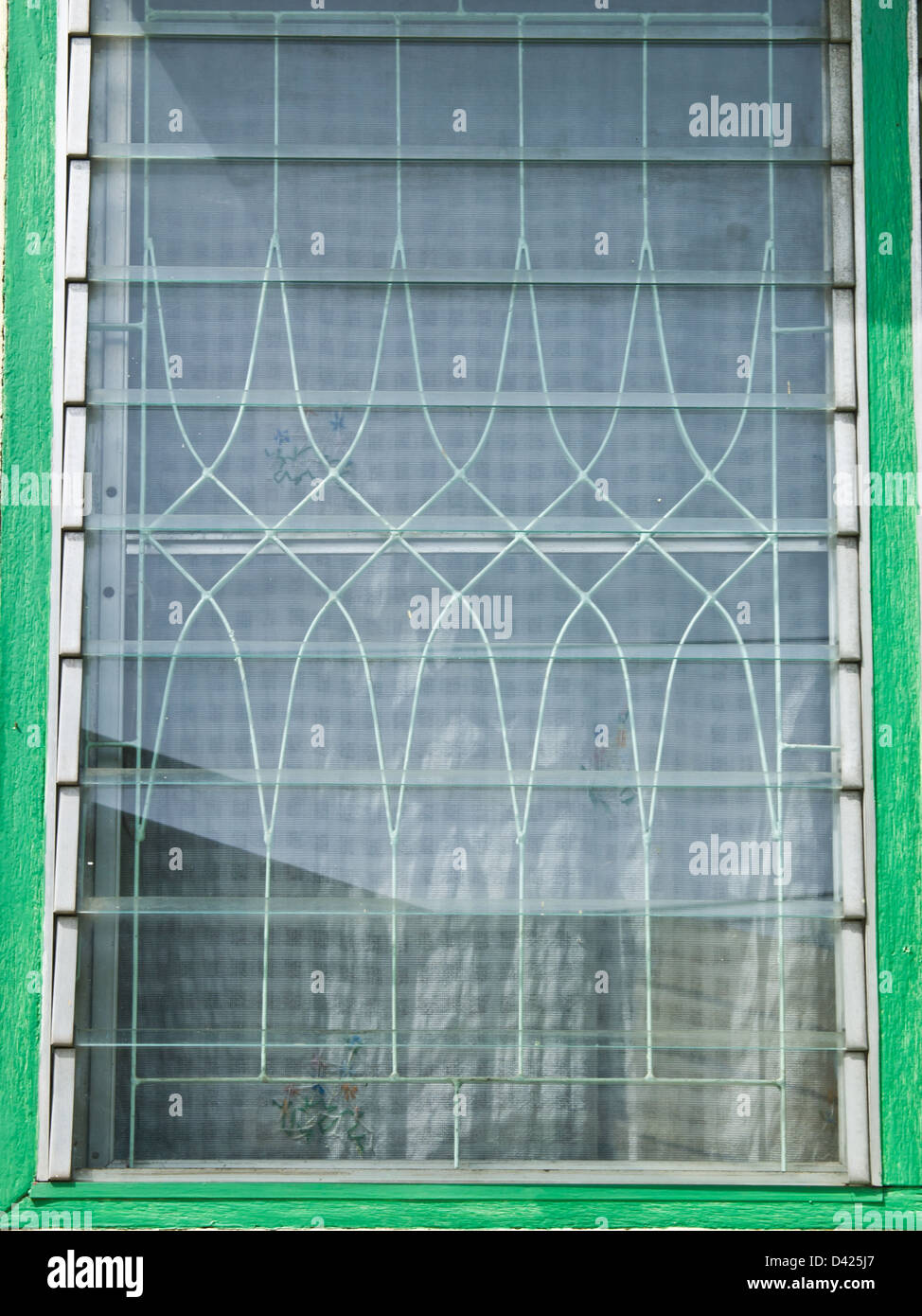 A closed glass lourve window Stock Photo - Alamy