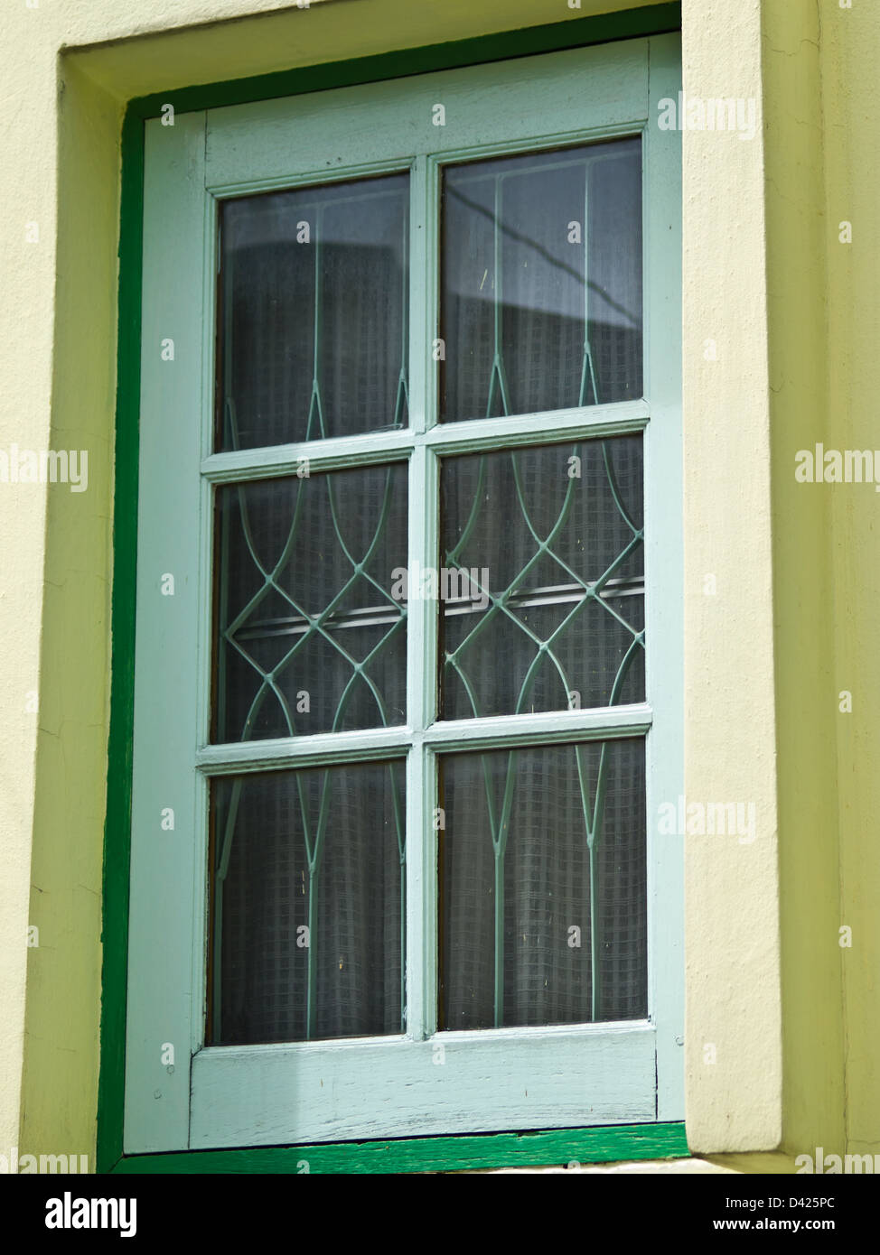 A light blue closed French panel window on yellow wall Stock Photo - Alamy