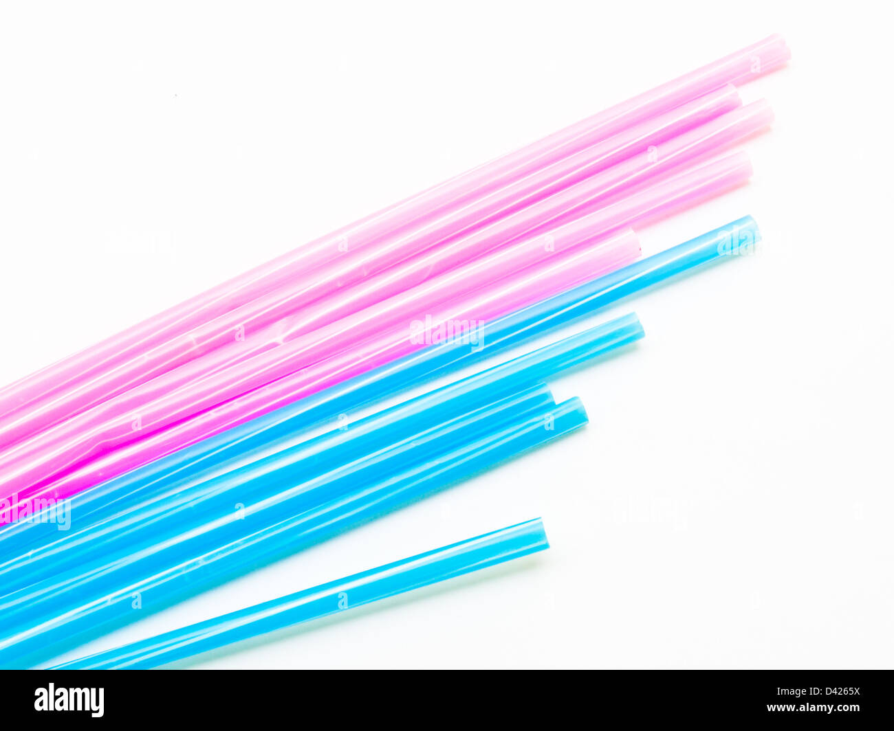 Light blue straws isolated on white background Stock Photo - Alamy