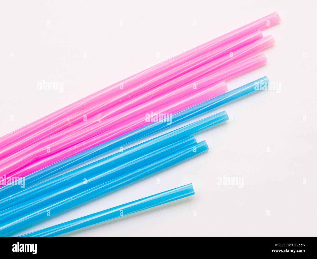 Light blue straws isolated on white background Stock Photo - Alamy