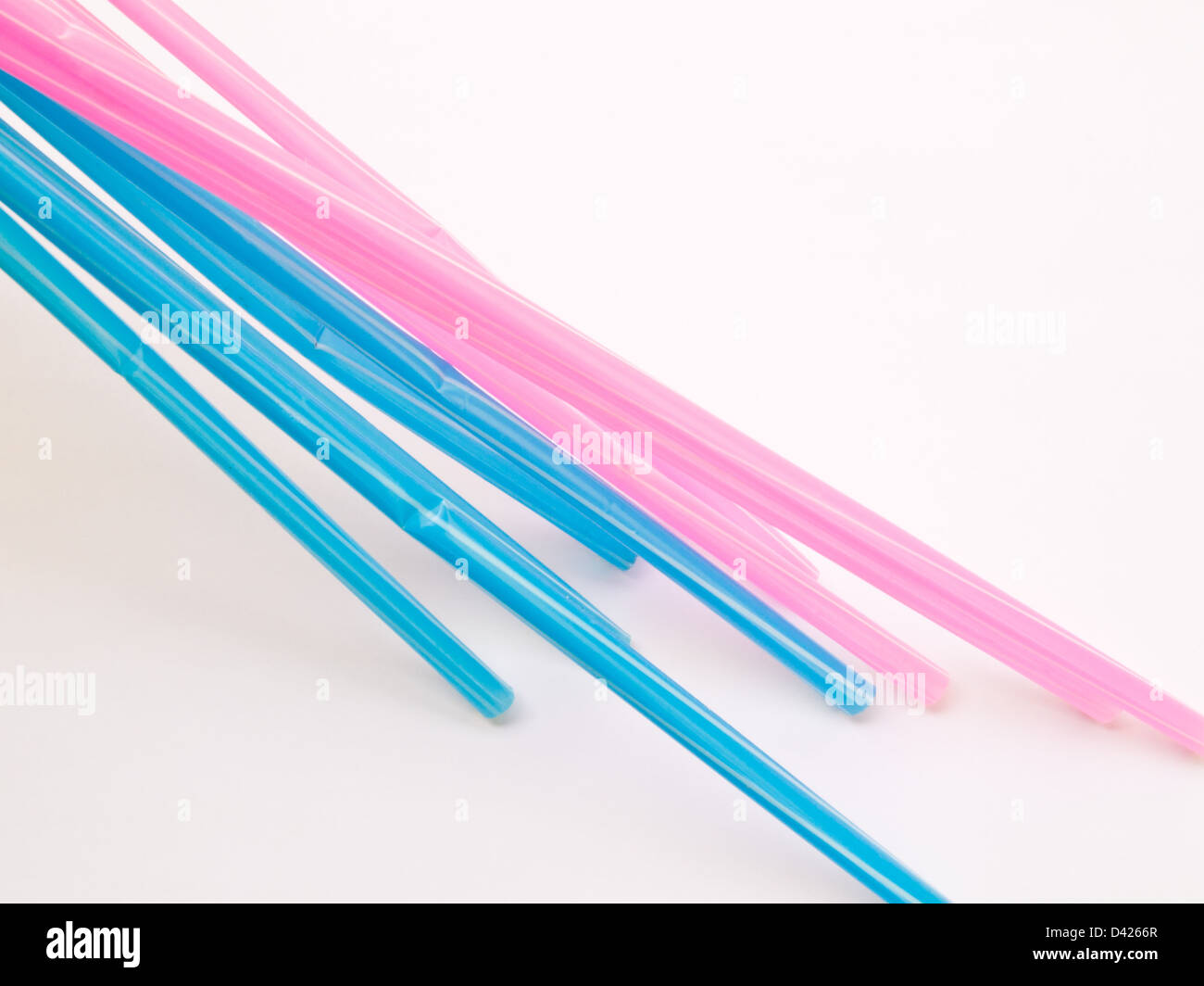 Light blue straws isolated on white background Stock Photo - Alamy