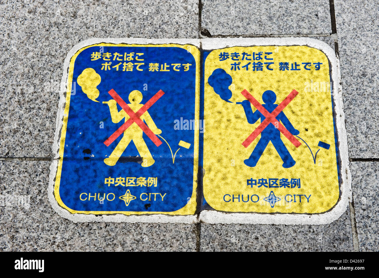 A sidewalk sign telling pedestrians in the Chuo Ward of downtown Tokyo ...