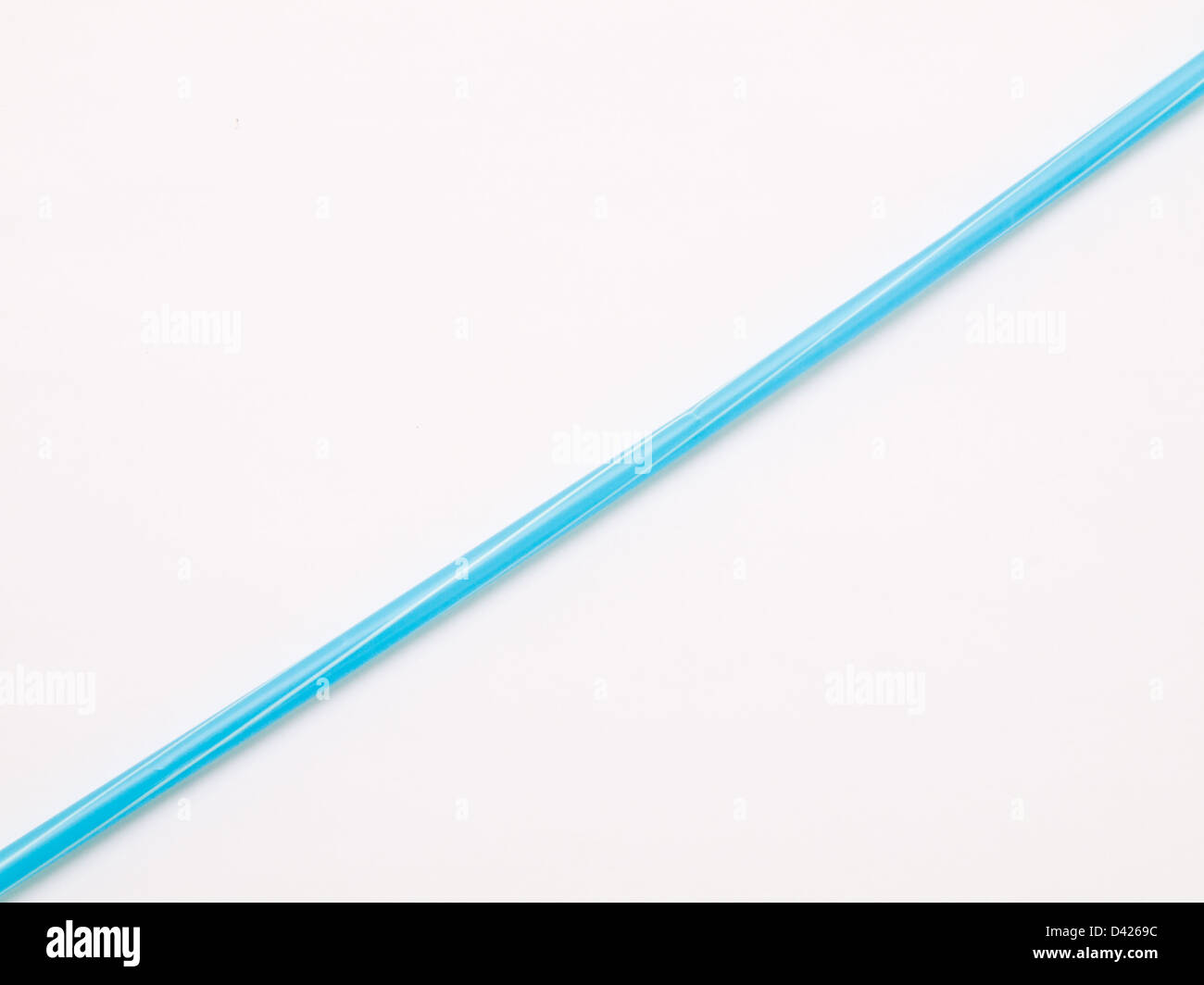 Light blue straw isolated on white background Stock Photo - Alamy