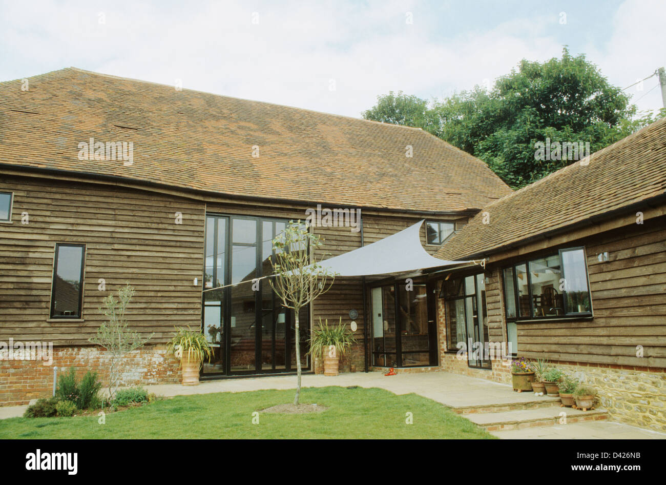 Traditional timbered barn conversion Stock Photo - Alamy