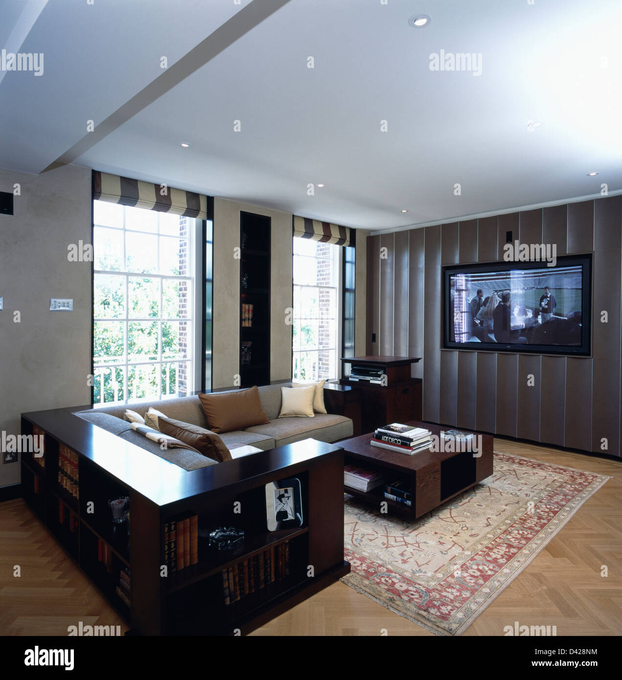 Large plasma screen on corrugated wall in modern apartment living room ...