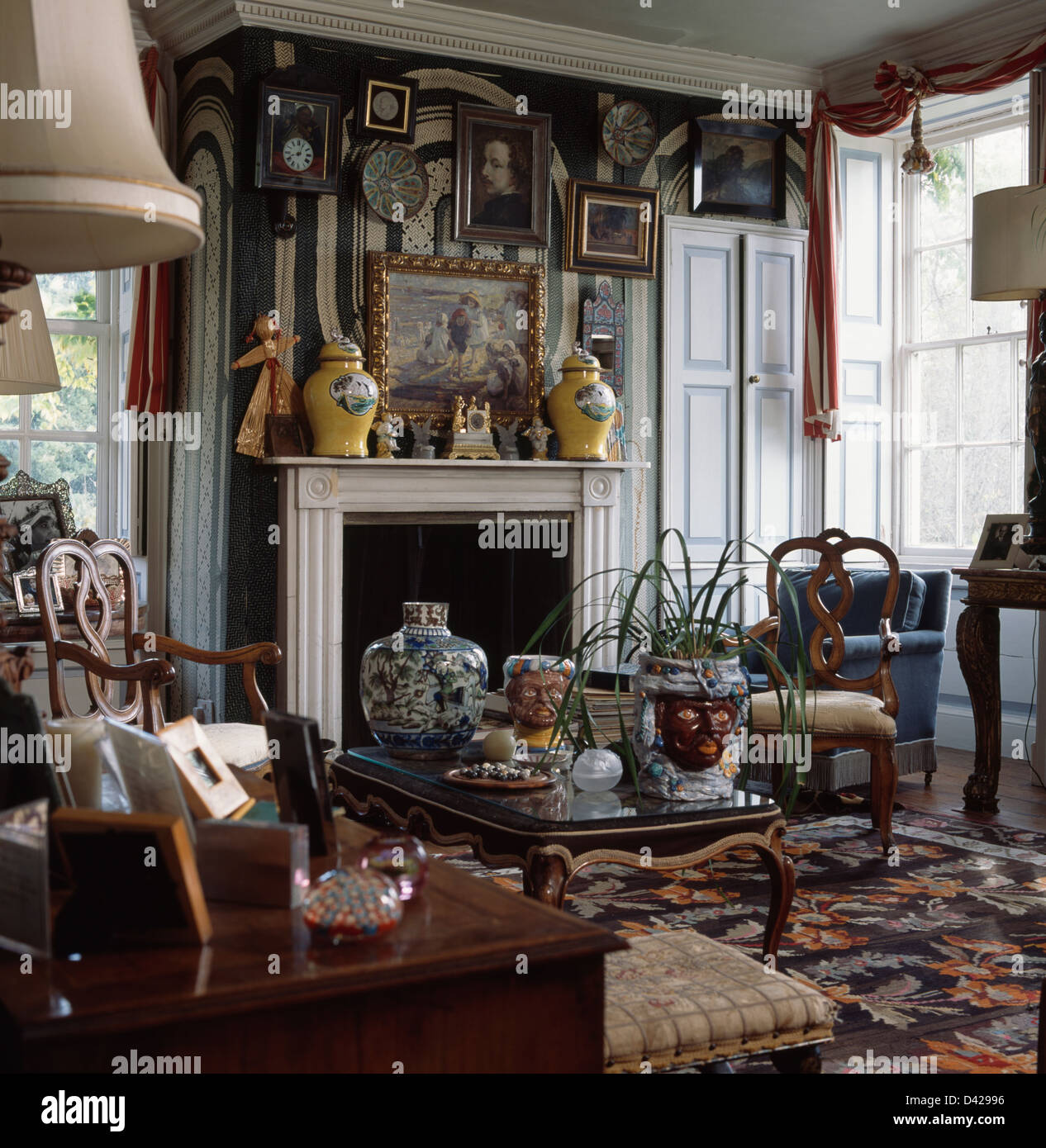 Large antique ceramic vases and furniture in country drawing room with ...