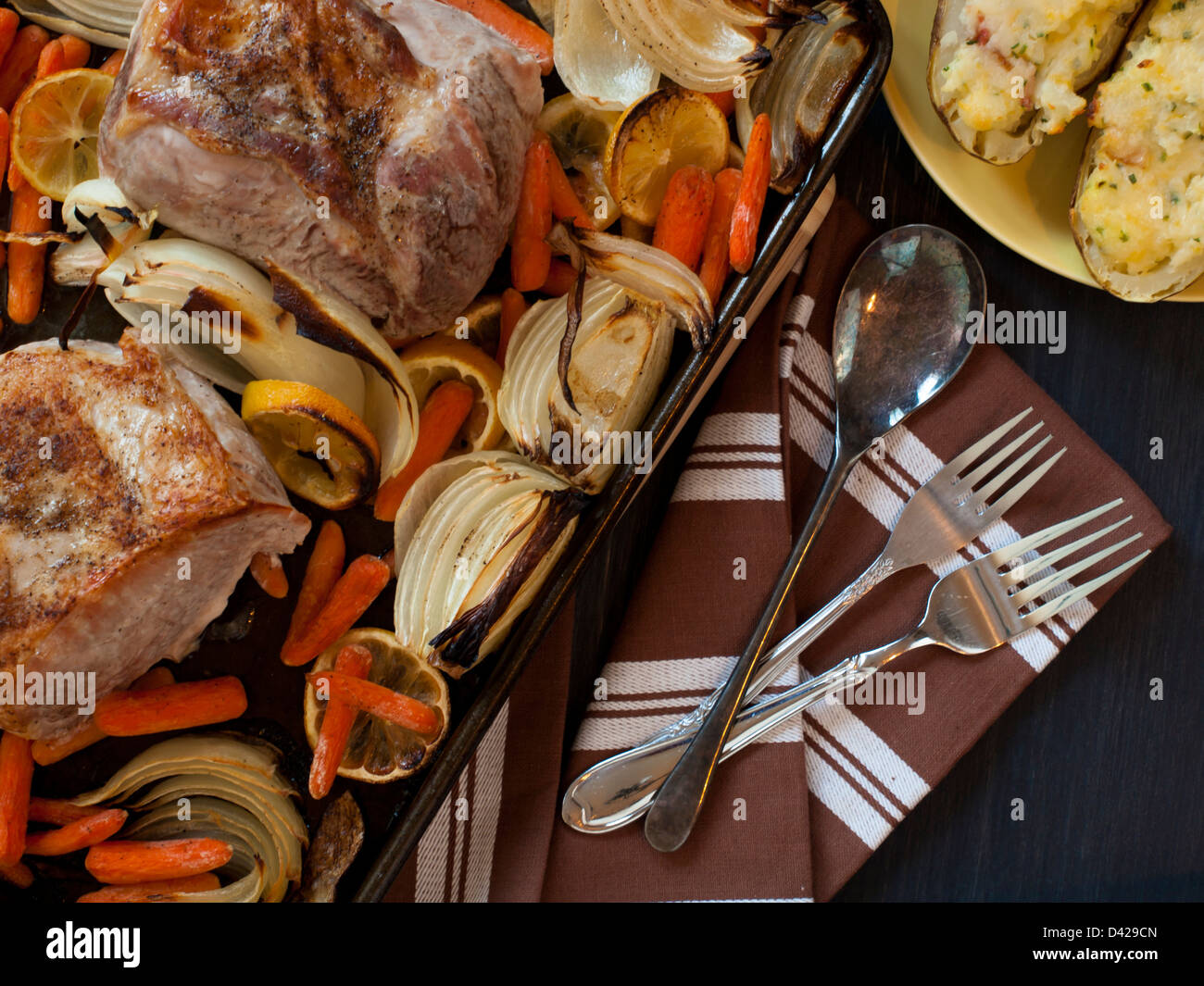 Pork lion with carrots, onion, and lemons Stock Photo - Alamy