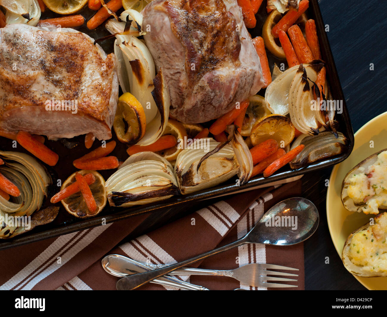 Pork lion with carrots, onion, and lemons Stock Photo - Alamy