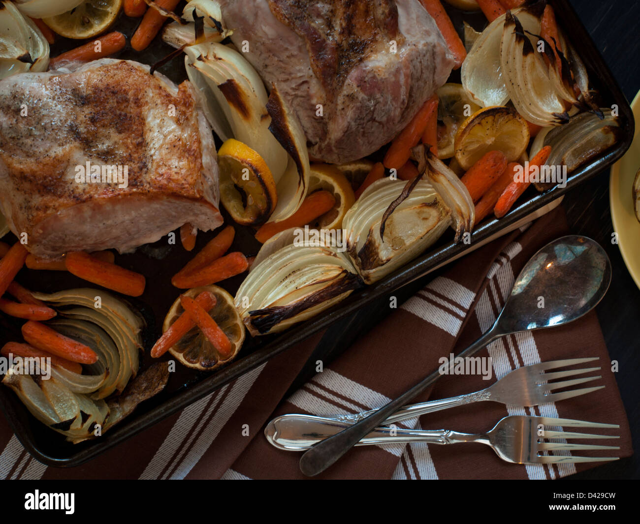 Pork lion with carrots, onion, and lemons Stock Photo - Alamy