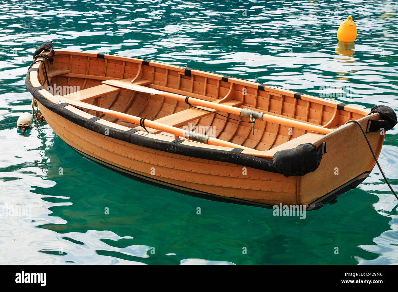 Small fishing boat on the water Stock Photo - Alamy