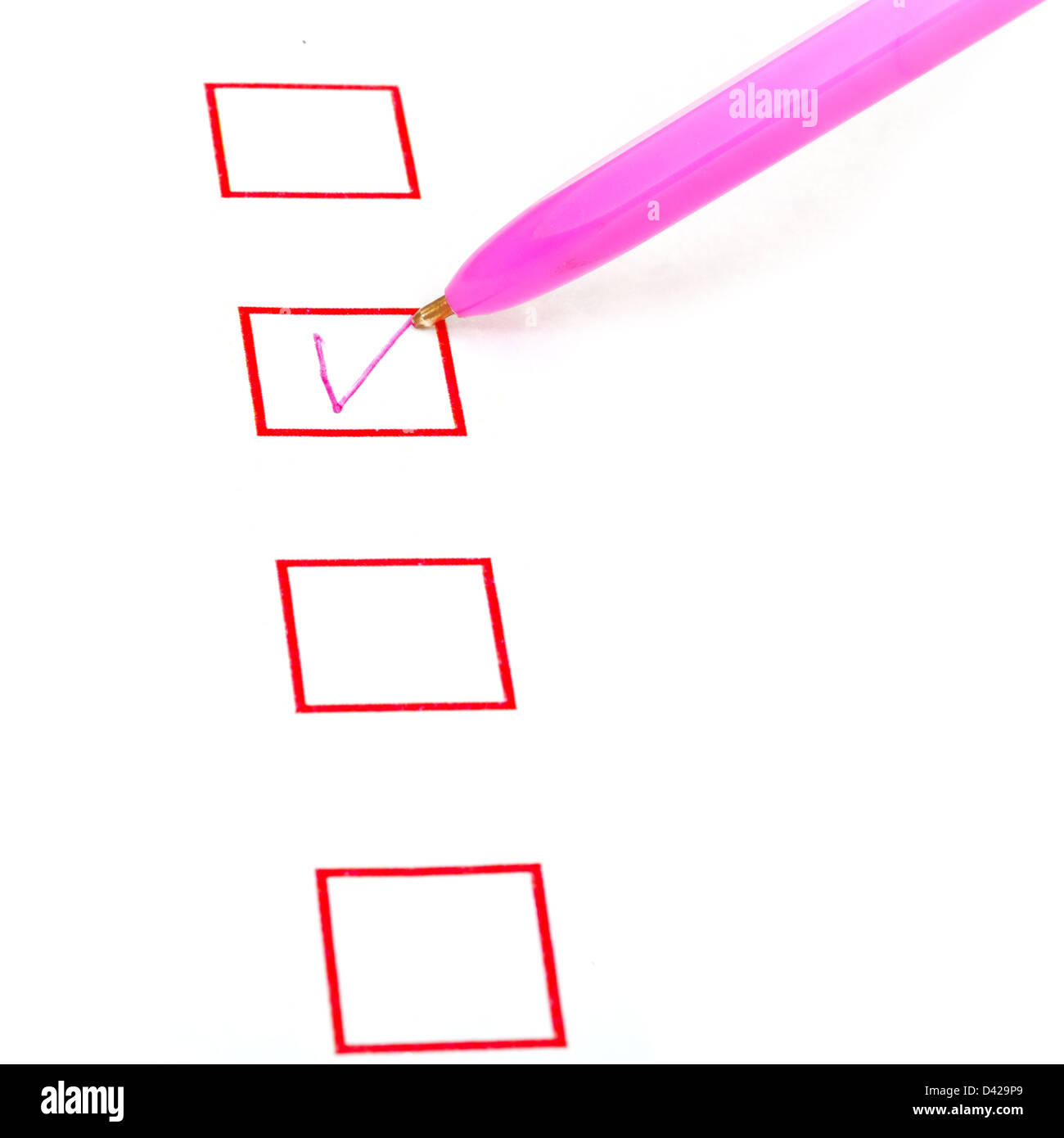 tick in red square box by pink ball pen Stock Photo - Alamy