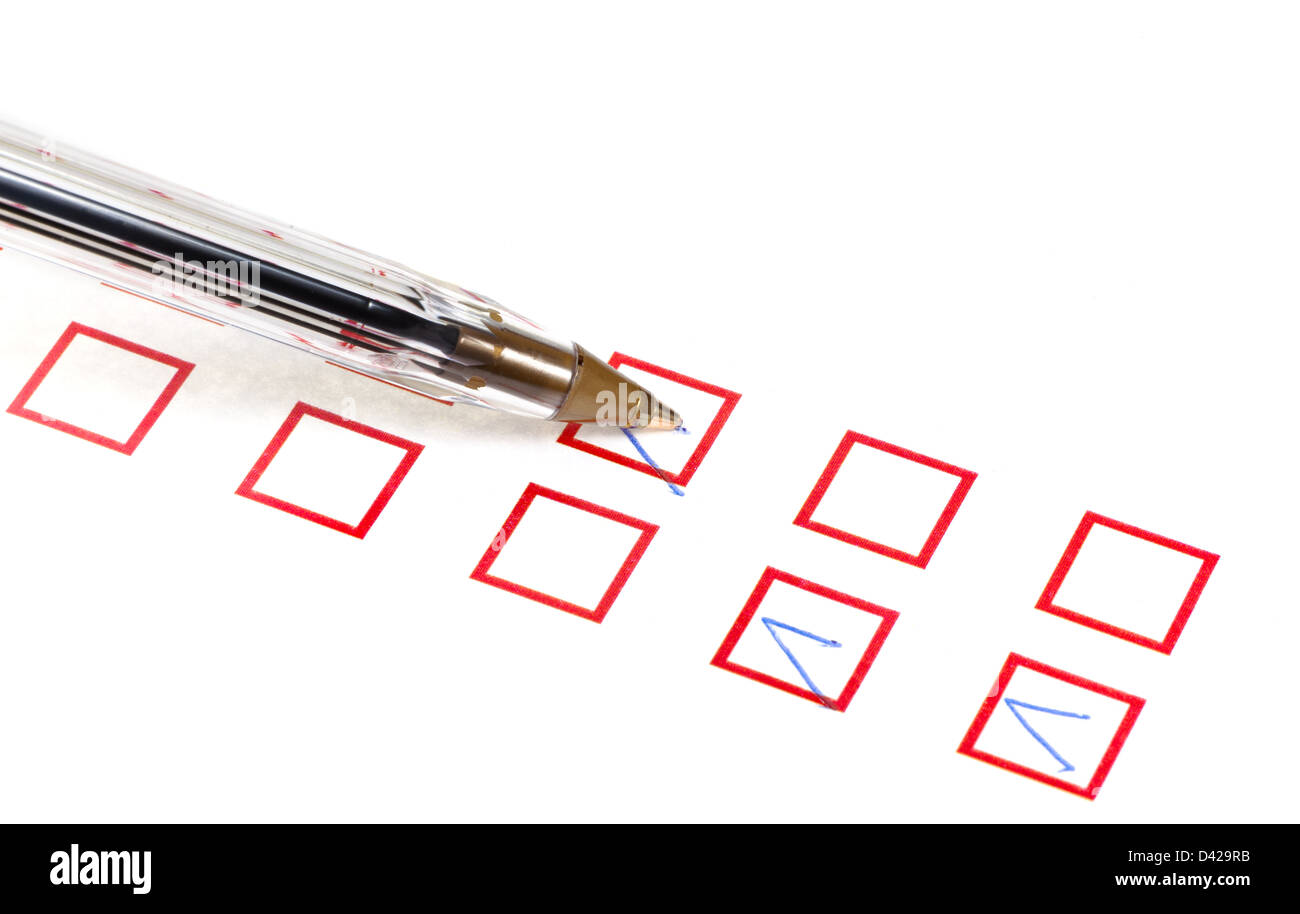 tick in red square box by blue plastic ball pen Stock Photo - Alamy