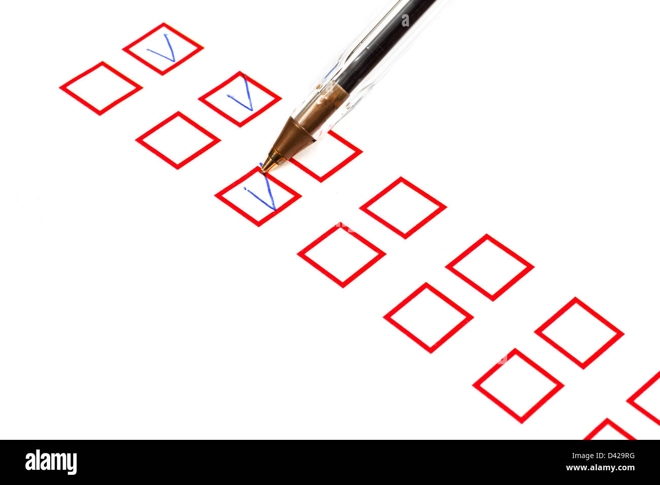 tick in red square box by simple blue plastic ball pen Stock Photo - Alamy